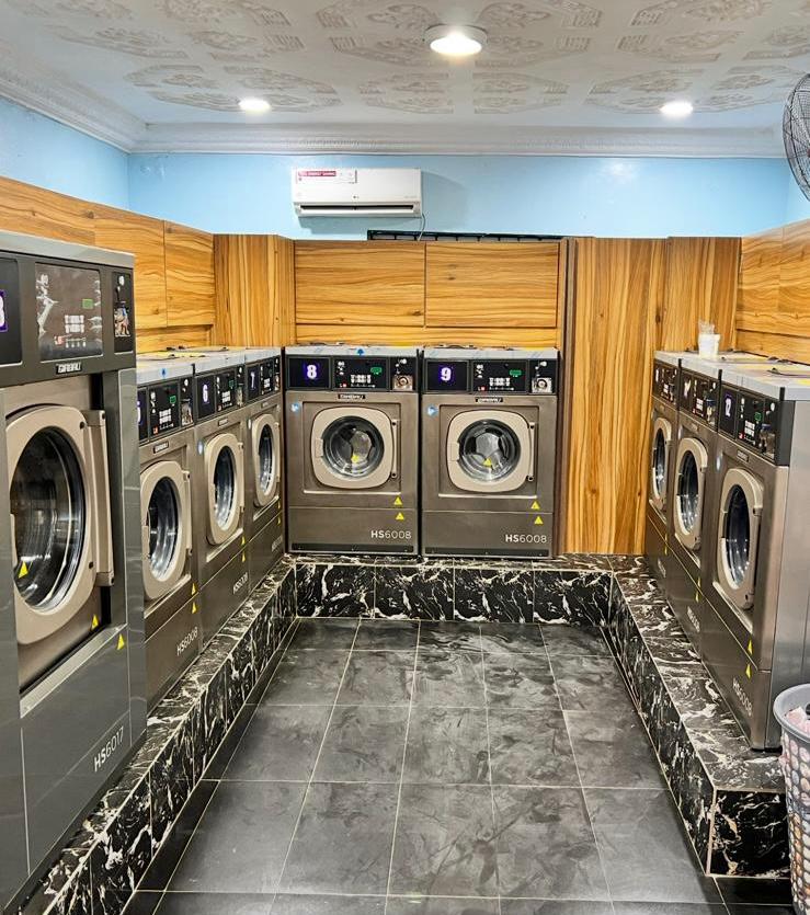 Professional laundry facility with modern washing machines